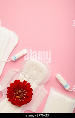 Menstrual tampons and pads on a pink background. Menstruation cycle ...