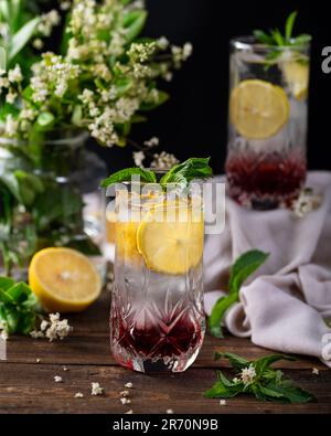 Lemons and mint leaves on wooden background, summer lemonade ...