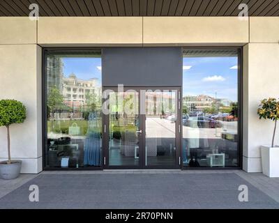 Glass partition mockup and modern doors in hall Stock Photo - Alamy