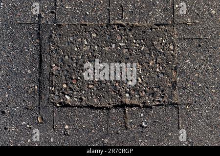 Damaged asphalt pavement , close up of a damaged and defective road ...