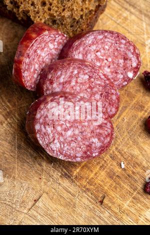 Sausage of moose meat cut into pieces, preparation of snacks from wild ...