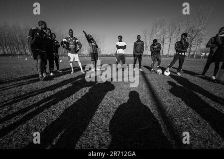 Italy, Parona, refugee center, football team Stock Photo - Alamy