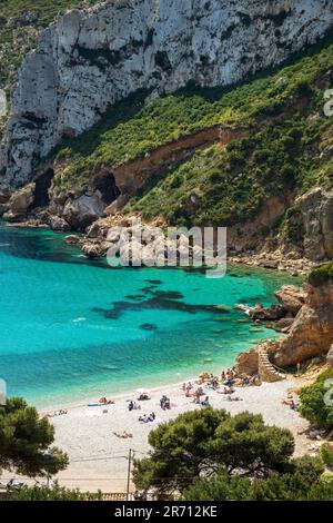The Beautiful beach of Platja Granadella Alicante in Spain with people ...