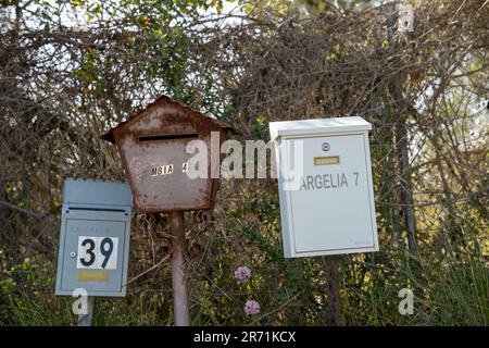 various colored mailboxes along the side of the road Stock Photo - Alamy