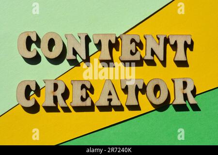 Content Creator, words in wooden alphabet letters isolated on yellow ...