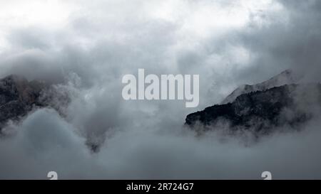 Veneto 2022. Parts of mountains, with trees and crevasses, that emerge ...
