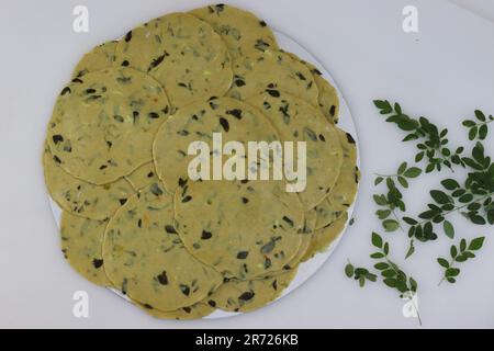 Ready to fry pressed poori made with whole wheat flour, mixed with ...