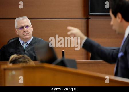 Judge Martin Fein looks at a witness during testimony during the trial ...