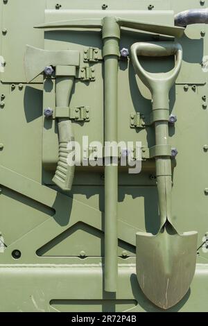 Spade attached to the side of an green armored vehicle Stock Photo - Alamy
