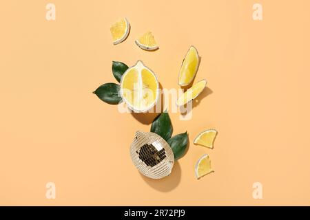 Disco balls with lemon inside on beige background Stock Photo - Alamy