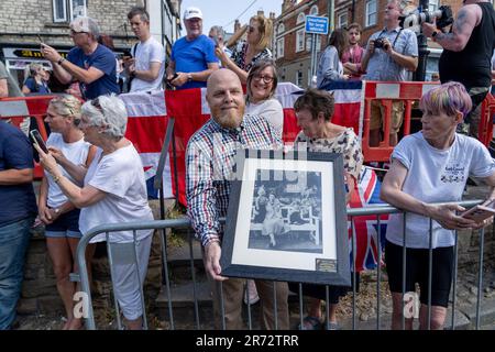 A well wisher who showed a picture to King Charles III during his visit ...