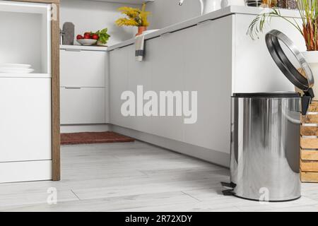 Opened metallic trash bin in interior of modern kitchen Stock Photo - Alamy
