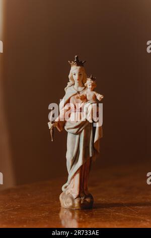catholic statue of lady helper Stock Photo - Alamy