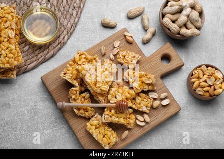 Candy bars and nuts on gray textured table Stock Photo - Alamy