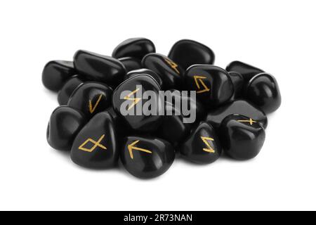 Pile of black rune stones isolated on white Stock Photo - Alamy