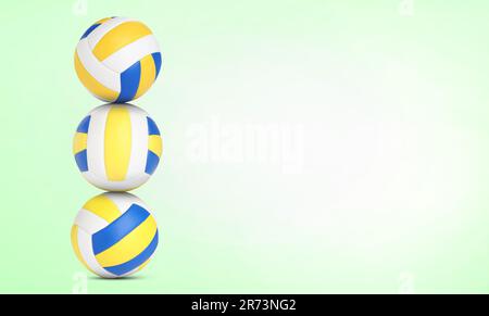 Stack of volleyball balls on pale light yellow background. Space for ...