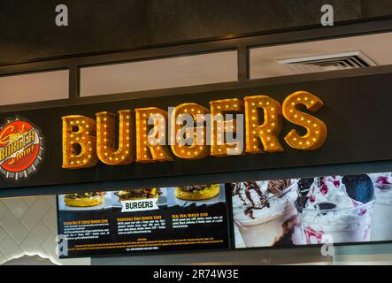 Burgers sign at Flavortown cafe restaurant bar, departure lounge area ...