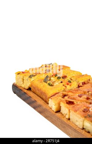 Homemade sweet Cornbread in a dish over white wooden background, top ...