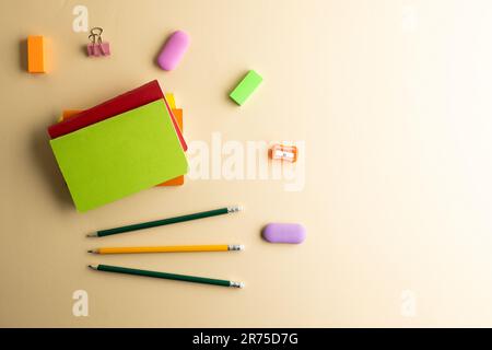 Flat lay of pencils, memo notes, sharpener and erasers with copy space ...