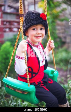 Bulgarian boy in ethnic folklore costume with traditional embroidery on ...