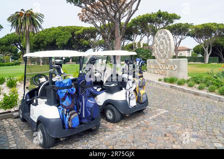 Welcome sign at Vale do Lobo golf club and course, with golf buggies ...