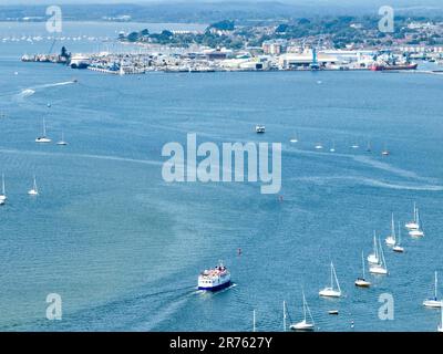 An aerial picture of Poole Harbour with a sightseeing boat crossing the ...