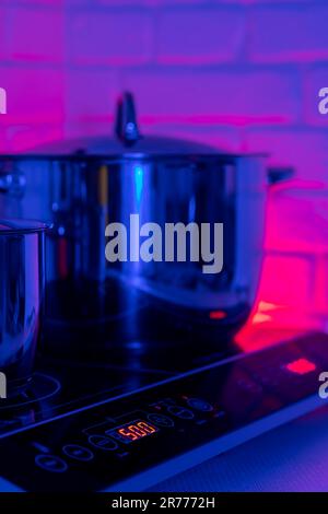 Metal Pot on induction hob in modern kitchen Stock Photo - Alamy
