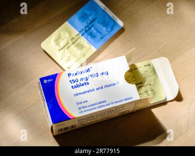 An open packet Plaxovid antiviral tablets by Pfizer - used in the ...