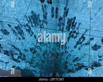 teamLab Planets, Tokyo: a room full of strings of LED lights, mirrored ...