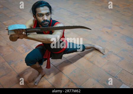 Performer demonstrates traditional Indian martial arts at the ...