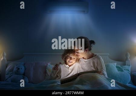 Air conditioner in bedroom. Kids room climate control. Mother and child ...