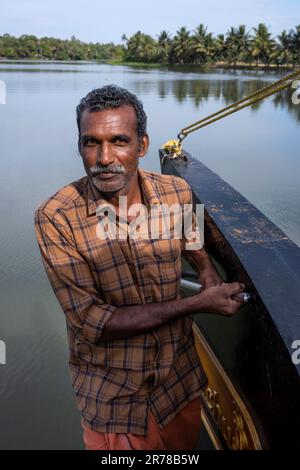 House boat captain on Vembanad Lakes, near the Arabian Sea, Alleppey ...