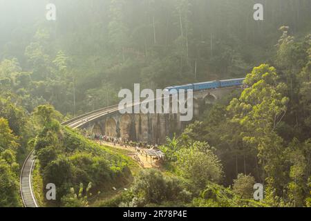 Train crosses Demodara nine arch bridge. Sri Lanka. Aerial background ...