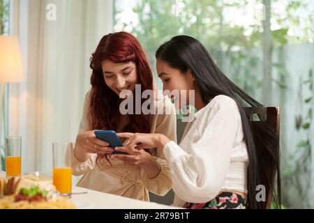 Asian women using smartphone for video call telemedicine consultation ...