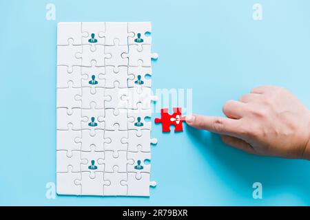 image of puzzle with people icons over wooden table ,human resources ...