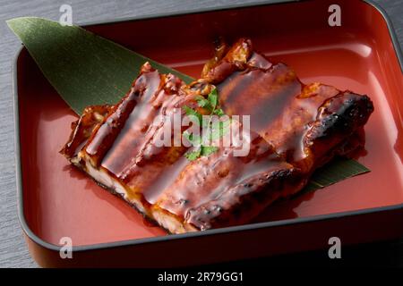 Japanese style cuisine - grilled eel with steamed rice and sauce Stock ...