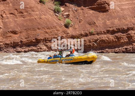 A mixed-race family in an inflatable raft in White's Rapid on the ...