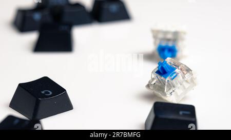 Scattered Key caps and Key switches for Mechanical Keyboards On White ...