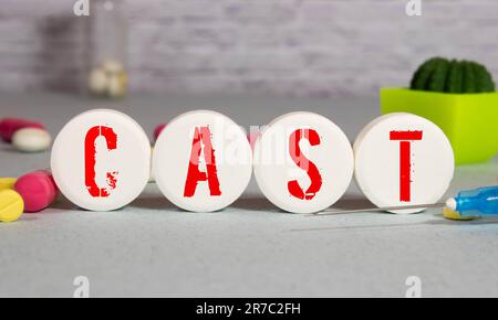 word CAST on round white tablets, medicine Stock Photo - Alamy
