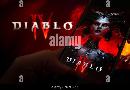 Diablo 4 game poster seen on mobile screen. Diablo IV is a game ...