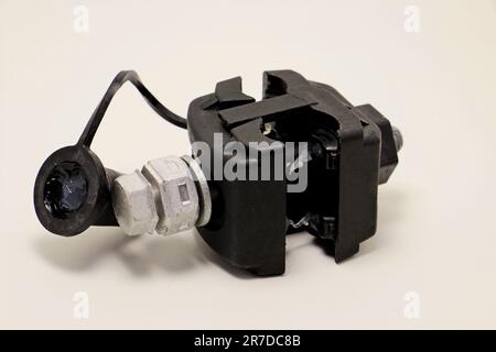 Insulated piercing clamp for sip wire insulation Stock Photo - Alamy