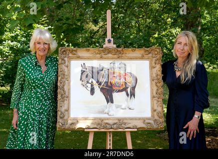 Queen Camilla is presented with an oil painting by artist Mandy ...