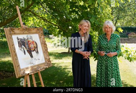 Queen Camilla is presented with an oil painting by artist Mandy ...