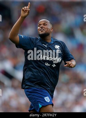 England's Chunkz celebrates scoring a goal in the arm up before Soccer ...