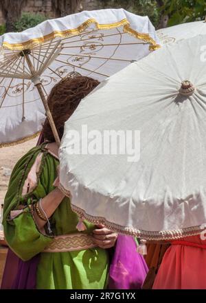 Reenactor women holding umbrella or umbraculum. Fashion in ancient rome ...