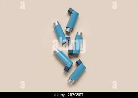 Asthma inhalers on beige background Stock Photo - Alamy