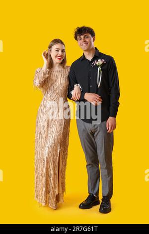 Beautiful prom couple on yellow background Stock Photo - Alamy