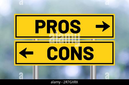 Pros or cons road sign on blue sky background Stock Photo - Alamy