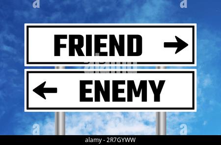 Friend or enemy road sign on sky background Stock Photo - Alamy