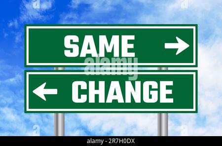 Change or same road sign on blur background Stock Photo - Alamy